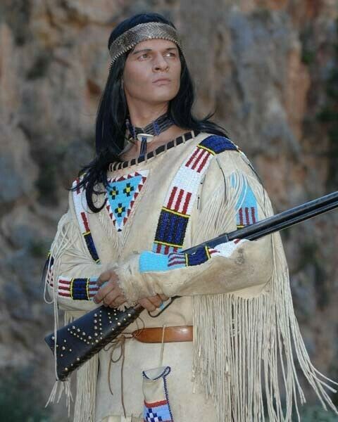 Pierrce Brice as Mescalero Apache chief Winnetou holding rifle 24x36 ...