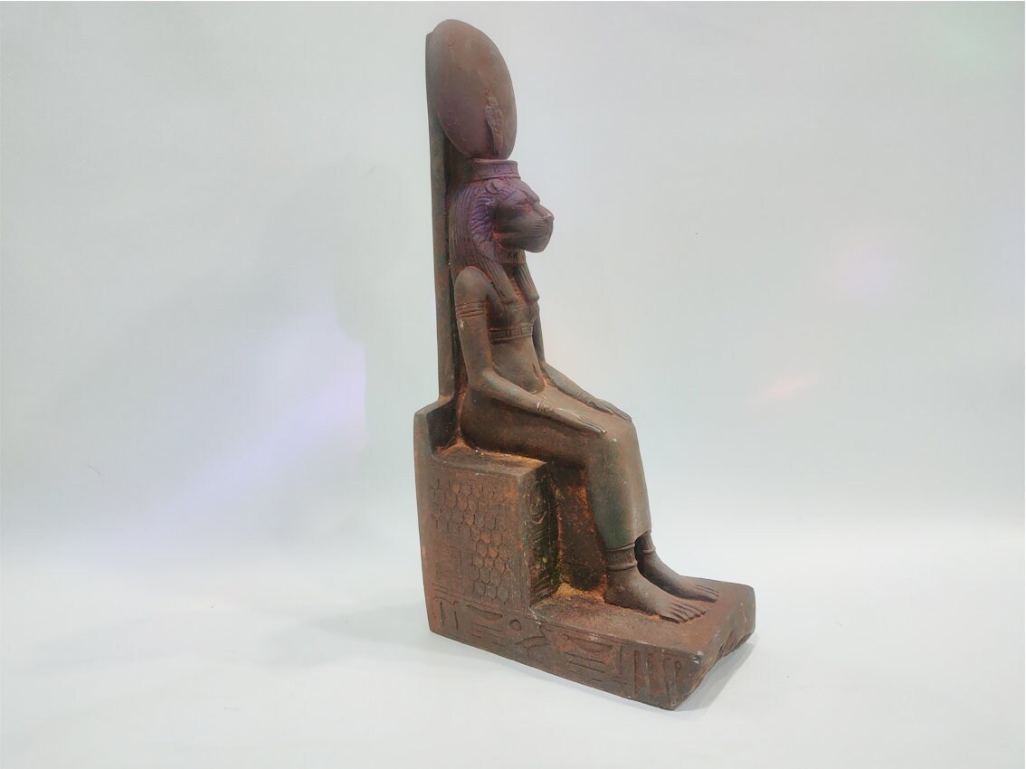 A seated statue of the goddess Sekhmet of solid stone. A rare museum ...