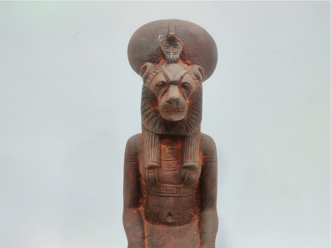 A seated statue of the goddess Sekhmet of solid stone. A rare museum ...