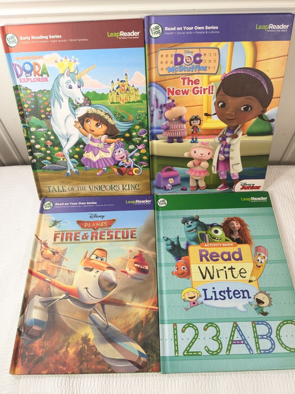LeapFrog LeapReader book set 4 Disney Planes Doc McStuffins Dora the ...