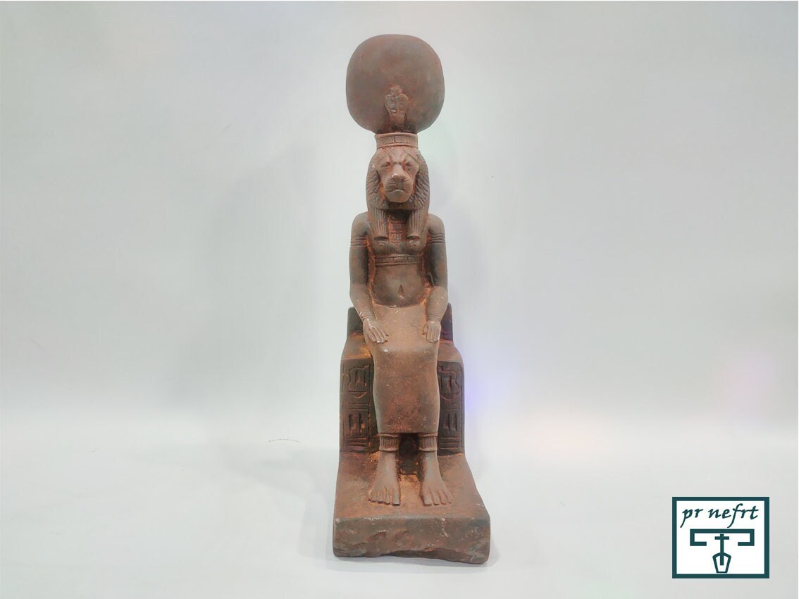 A seated statue of the goddess Sekhmet of solid stone. A rare museum ...