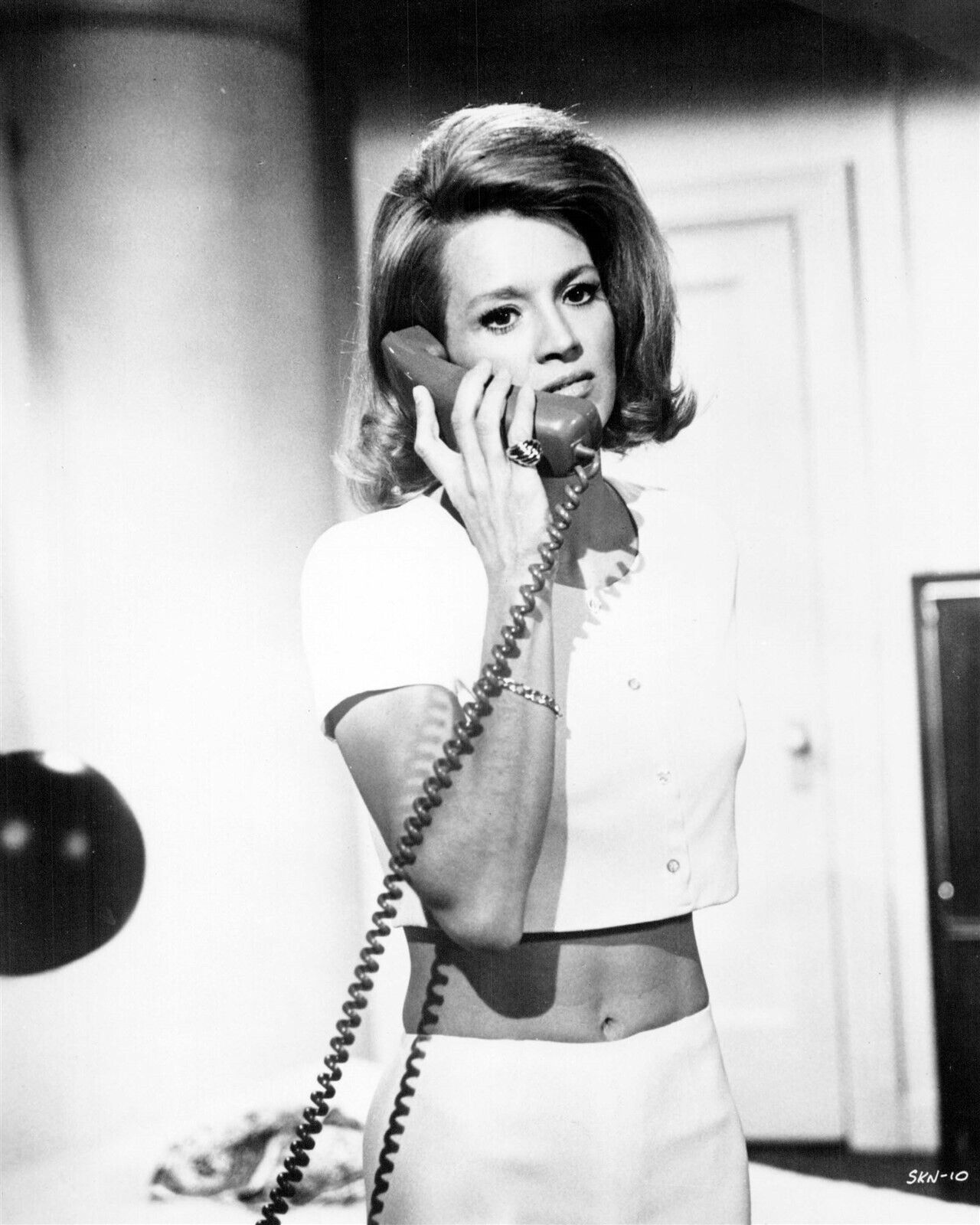 Angie Dickinson on telephone in two piece and similar items
