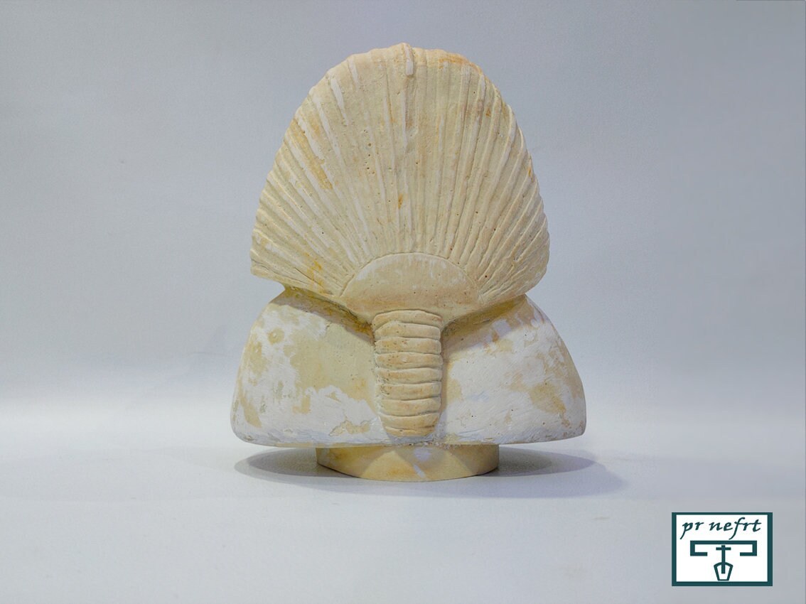 The lid of King Tutankhamun's Canopus jar. The head of King Tutankhamun ...